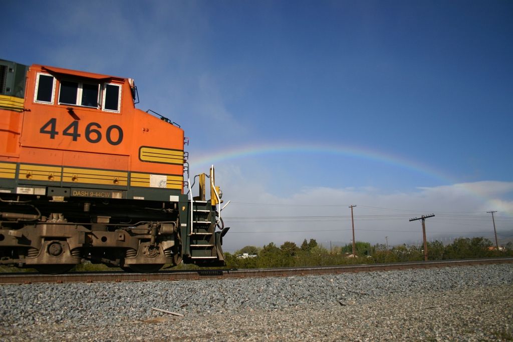 BNSF 4460 sits under the rainbow